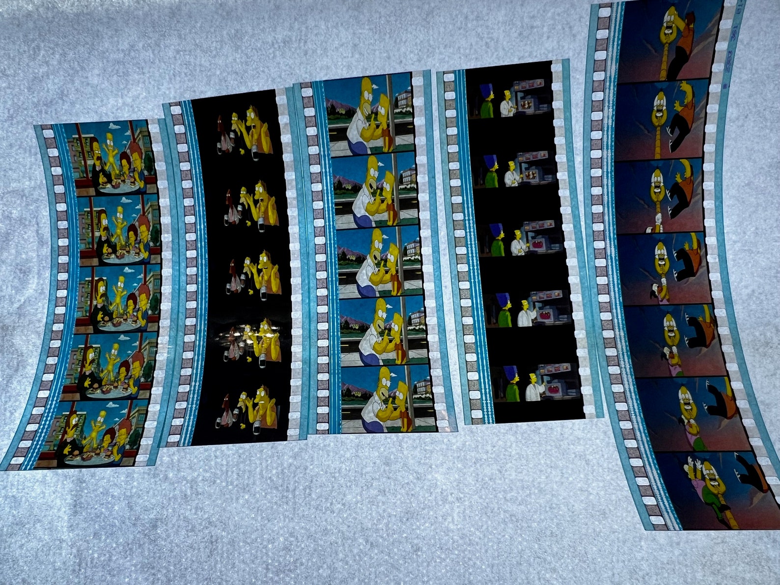 The Simpsons Movie Genuine 35mm Film Cell Strips, 5 Strips of 5 Cells ...