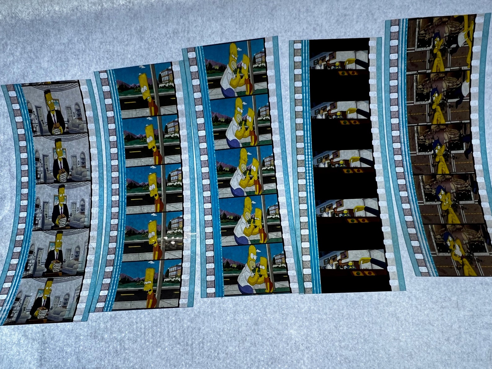 The Simpsons Movie Genuine 35mm Film Cell Strips, 5 Strips of 5 Cells ...