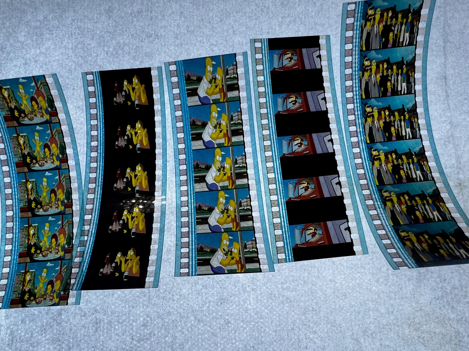 The Simpsons Movie Genuine 35mm Film Cell Strips, 5 Strips of 5 Cells ...