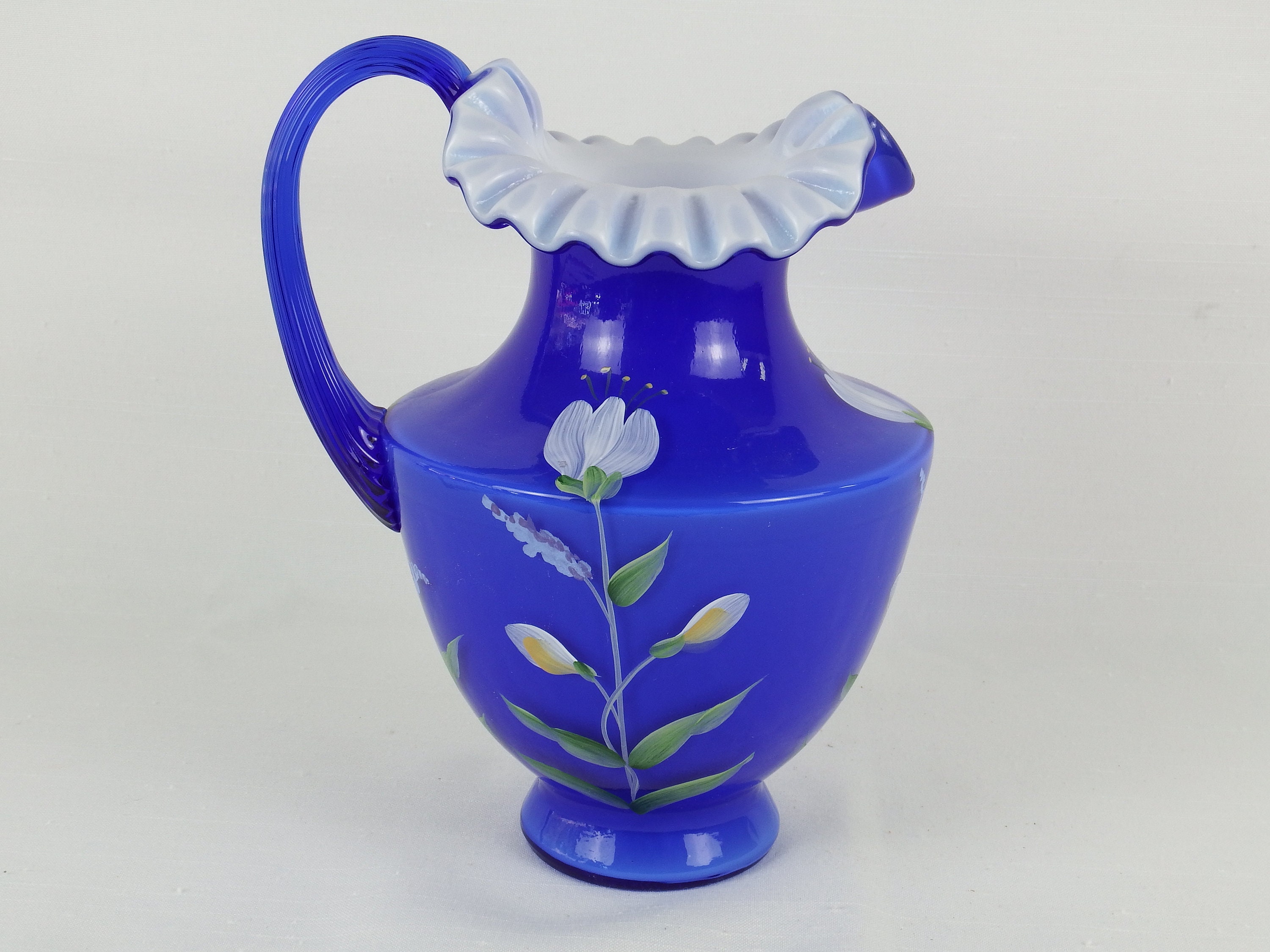 Fenton Art Glass 1999 Cobalt Overlay Pitcher With Hand Painted White ...