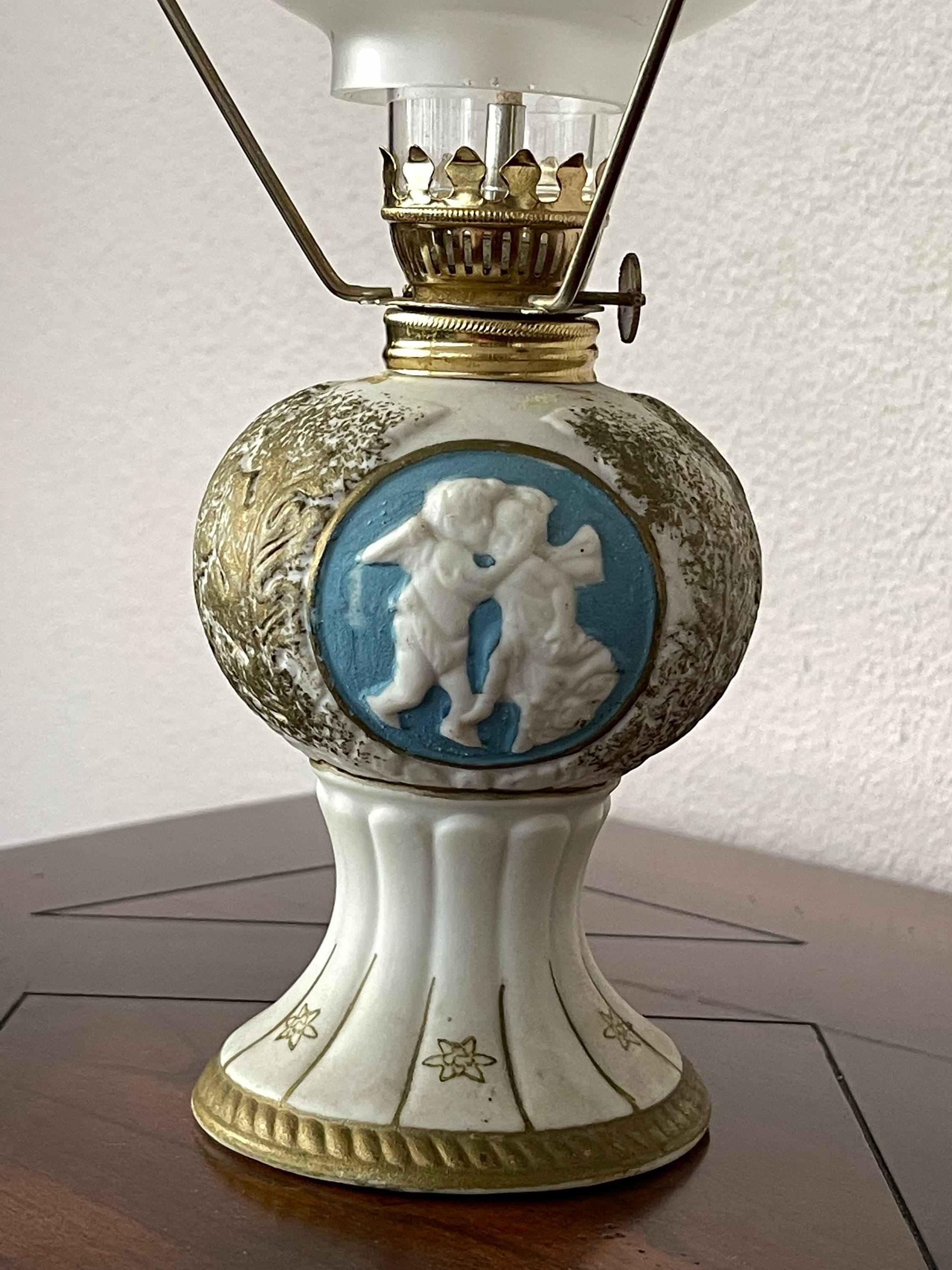 Figural Ceramic Oil Lamp With a Brass Burner Surmounted by an Etched ...