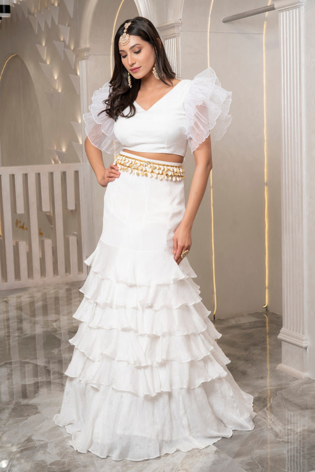 White Ruffle Lehenga Choli is a Traditional Outfit That Includes White ...
