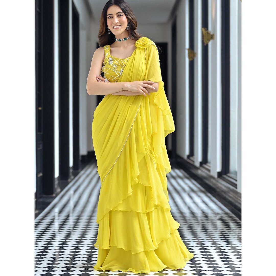 Designer Yellow Georgette Ruffle Saree With A Sleeveless Handwork ...