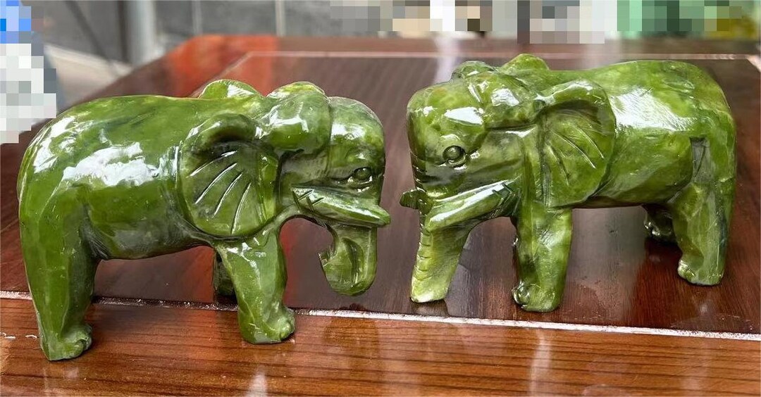 A Pair of Green Jade Carved Beautiful and Lovely Elephants Holding ...