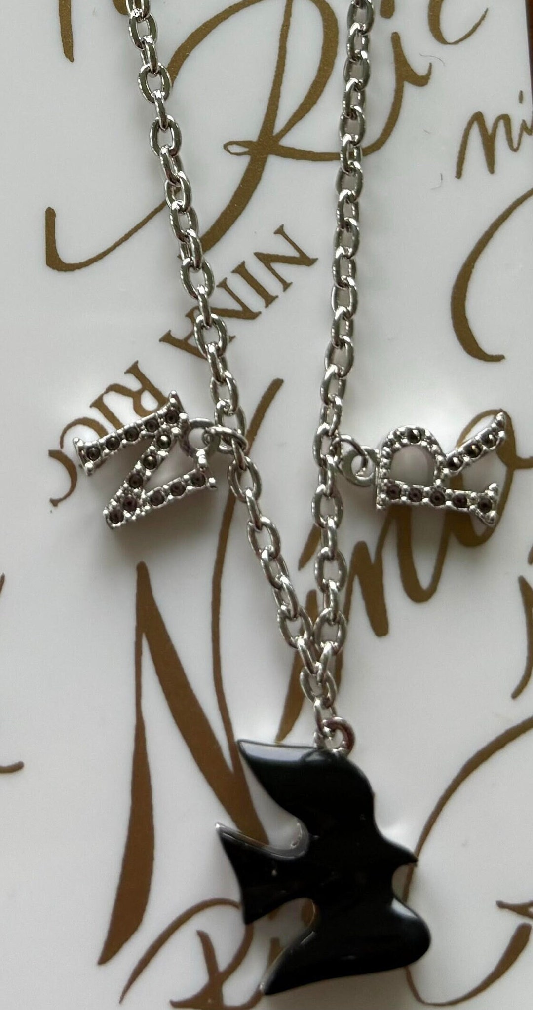 Nina Ricci LOGO Pendant W Dove. Rhodium, Plated W Handset Swarovski ...