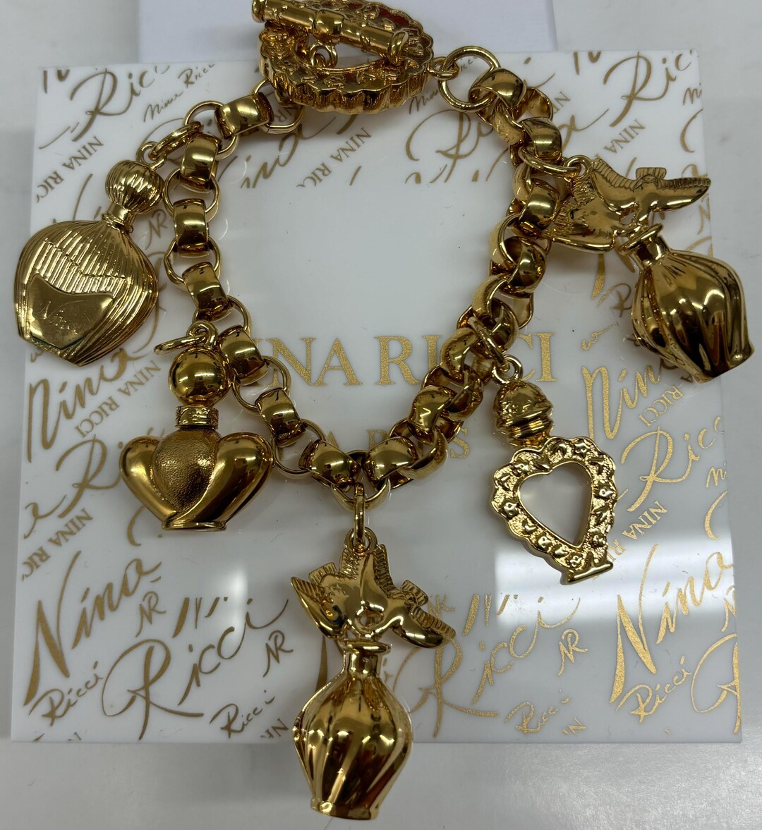 Nina Ricci LOGO Bracelet , Hats, Perfume Bottles, Hearts, Euro Closure ...