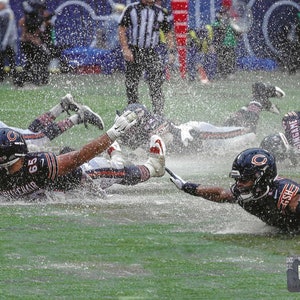 Chicago Bears Star Quarterback Justin Fields & Team Sliding in the Rain ...