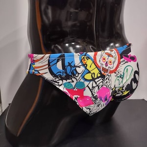 Cartoon Chaos Men's Swim Bikini Brief Half Back Cheeky Thong by Rayze ...