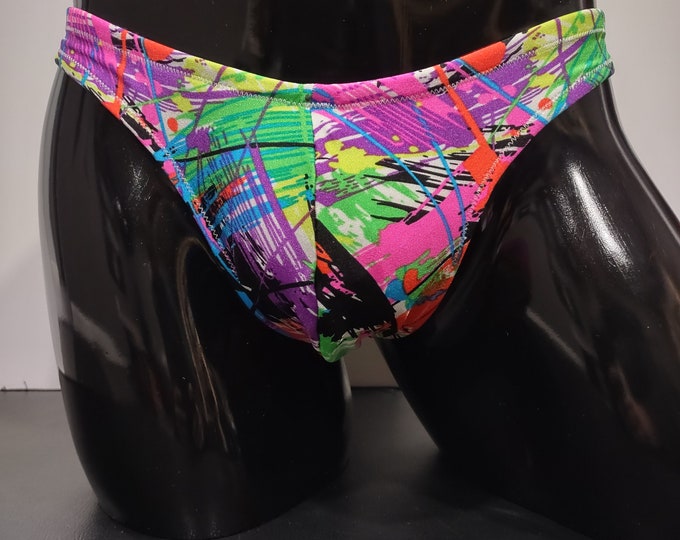 Rainbow Splatter Men's Swim Bikini Brief Half Back Cheeky Thong by ...