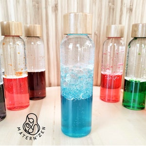 Botella sensorial líquida de la calma Lampara de lava Montessori ...