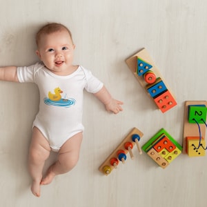 Rubber Ducky Onesie® Floating Duck & Toy Ship Graphic Onesie® Toy ...