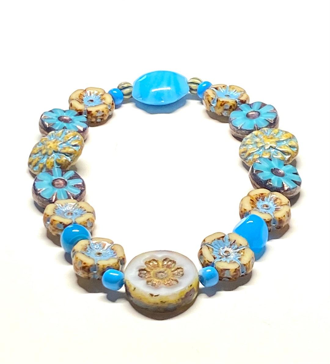 Blue Variegated Czech Glass Flower Bead Bracelet Adorned By Cream And