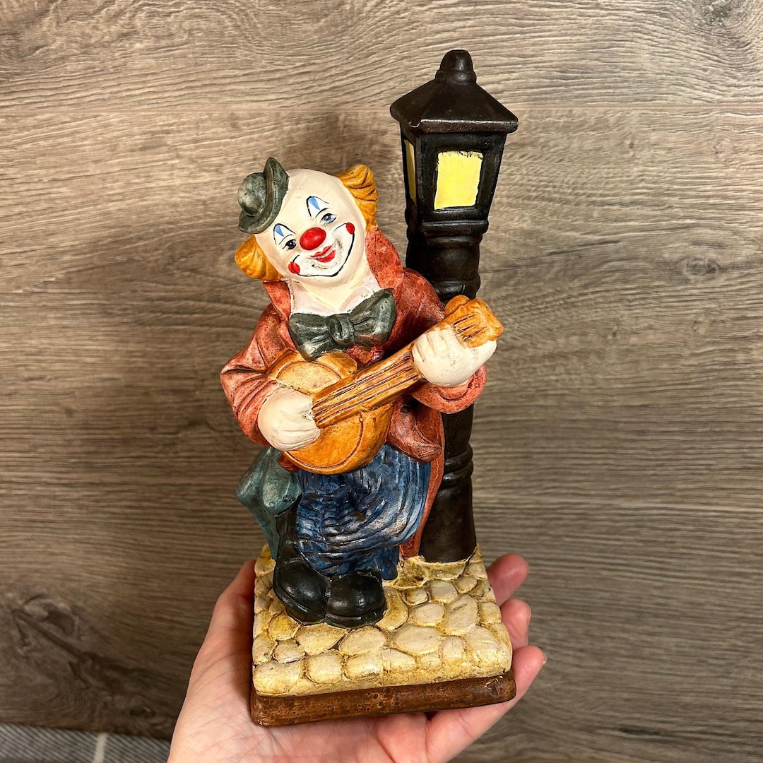 Vintage Happy Smiley Clown Playing a Banjo & Leaning Against an Old ...