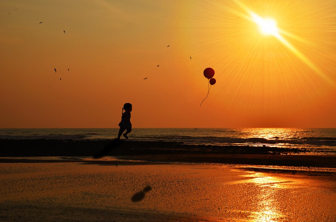 Sunset Child Chasing Balloons on Beach - Etsy