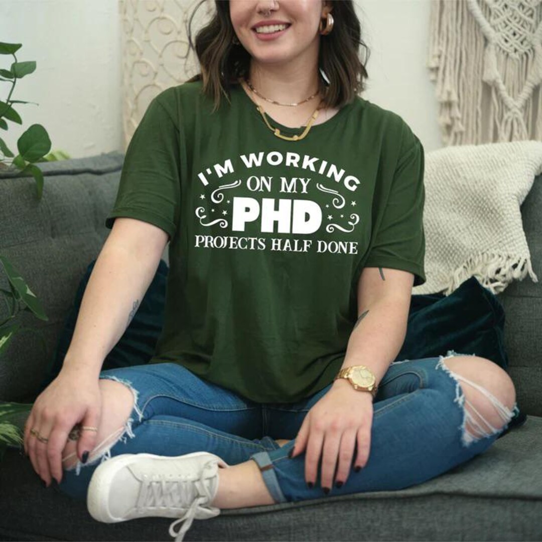I'm Working on My PHD — Projects Half Done T-shirt | White Ink Print ...