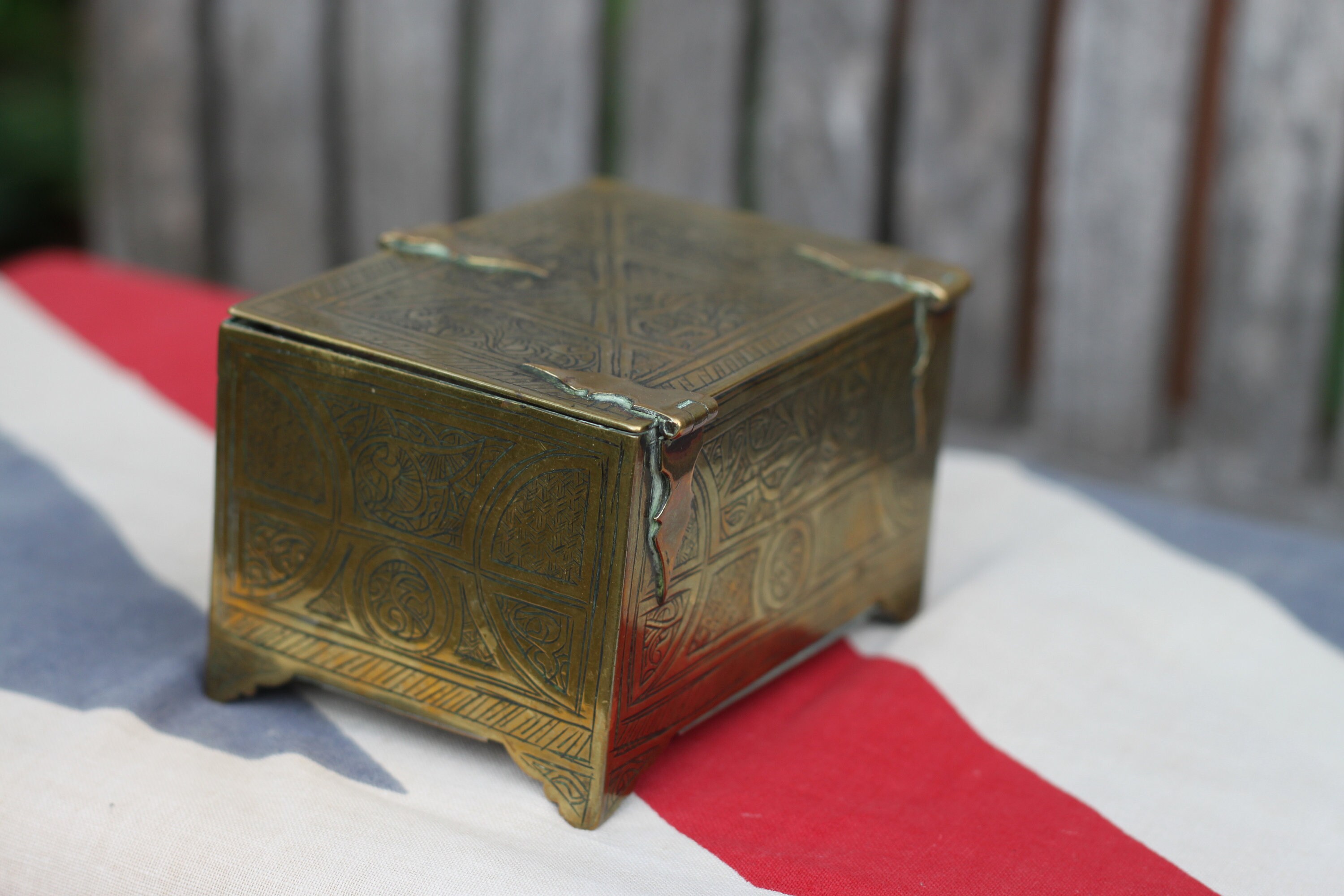 An Islamic Brass Four Footed Casket Engraved With an Entwined Floral ...