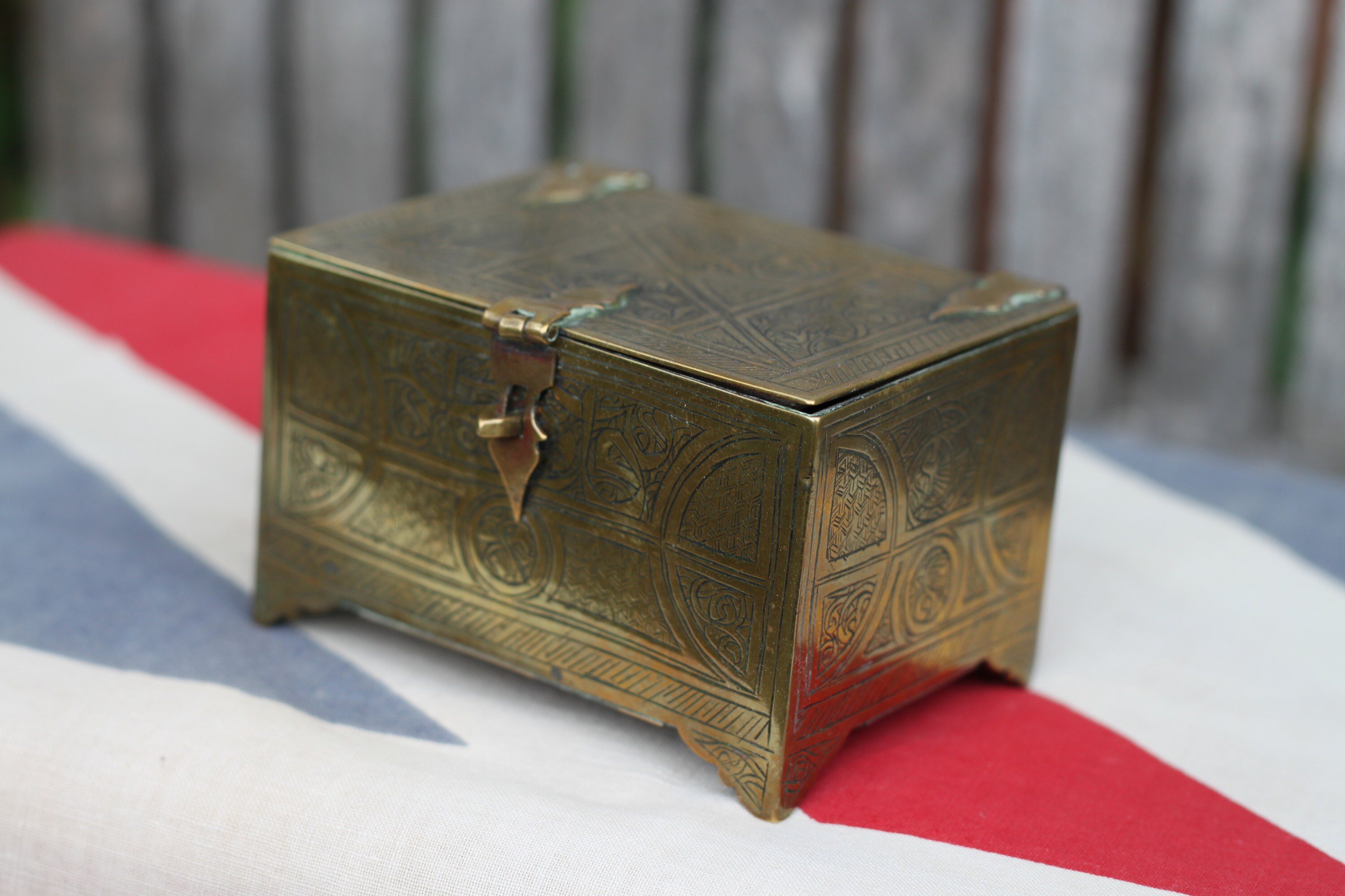 An Islamic Brass Four Footed Casket Engraved With an Entwined Floral ...