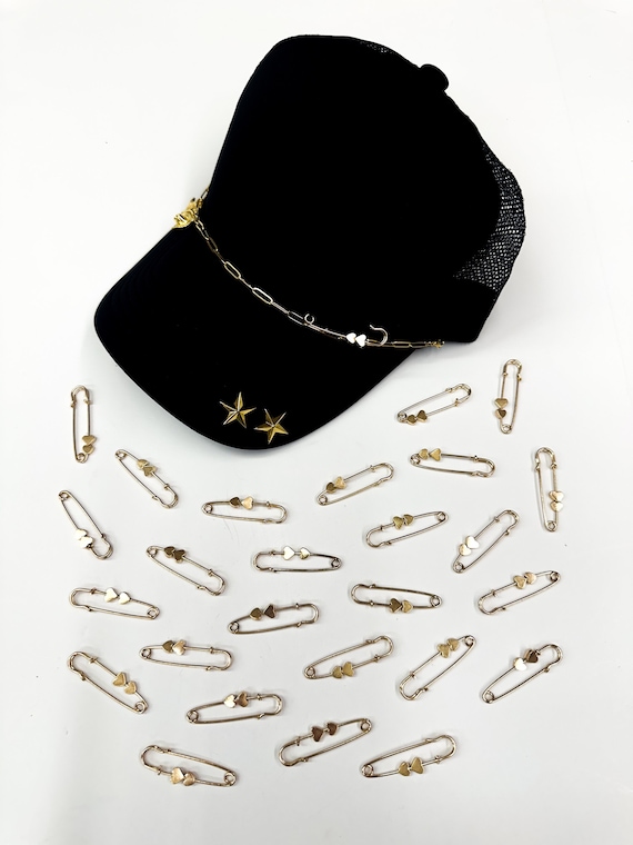 Safety pin cap store