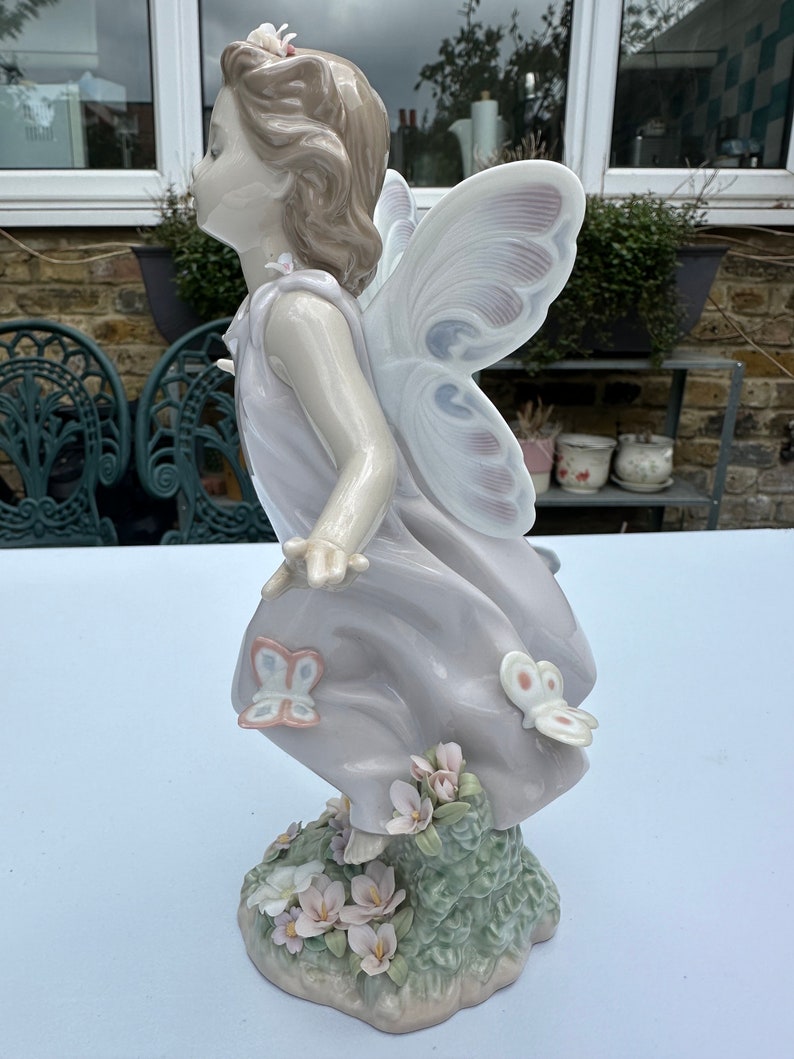 A Lladro 6875 Porcelain Figurine of a Fairy With Butterfly Wings Among ...