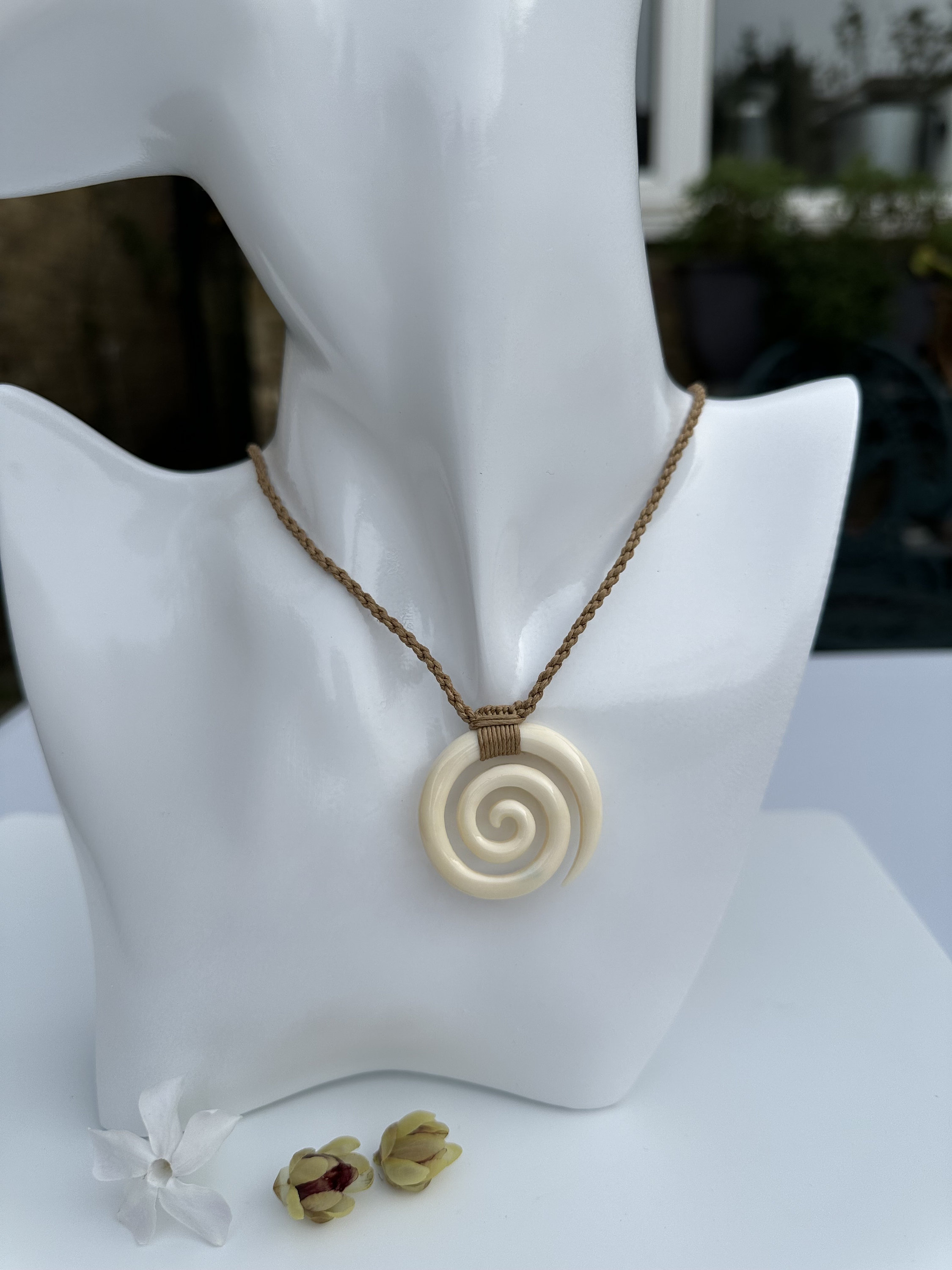 A Maori Engraved Bone Hei Matau Fish Hook Pendant Necklace and A Maori ...