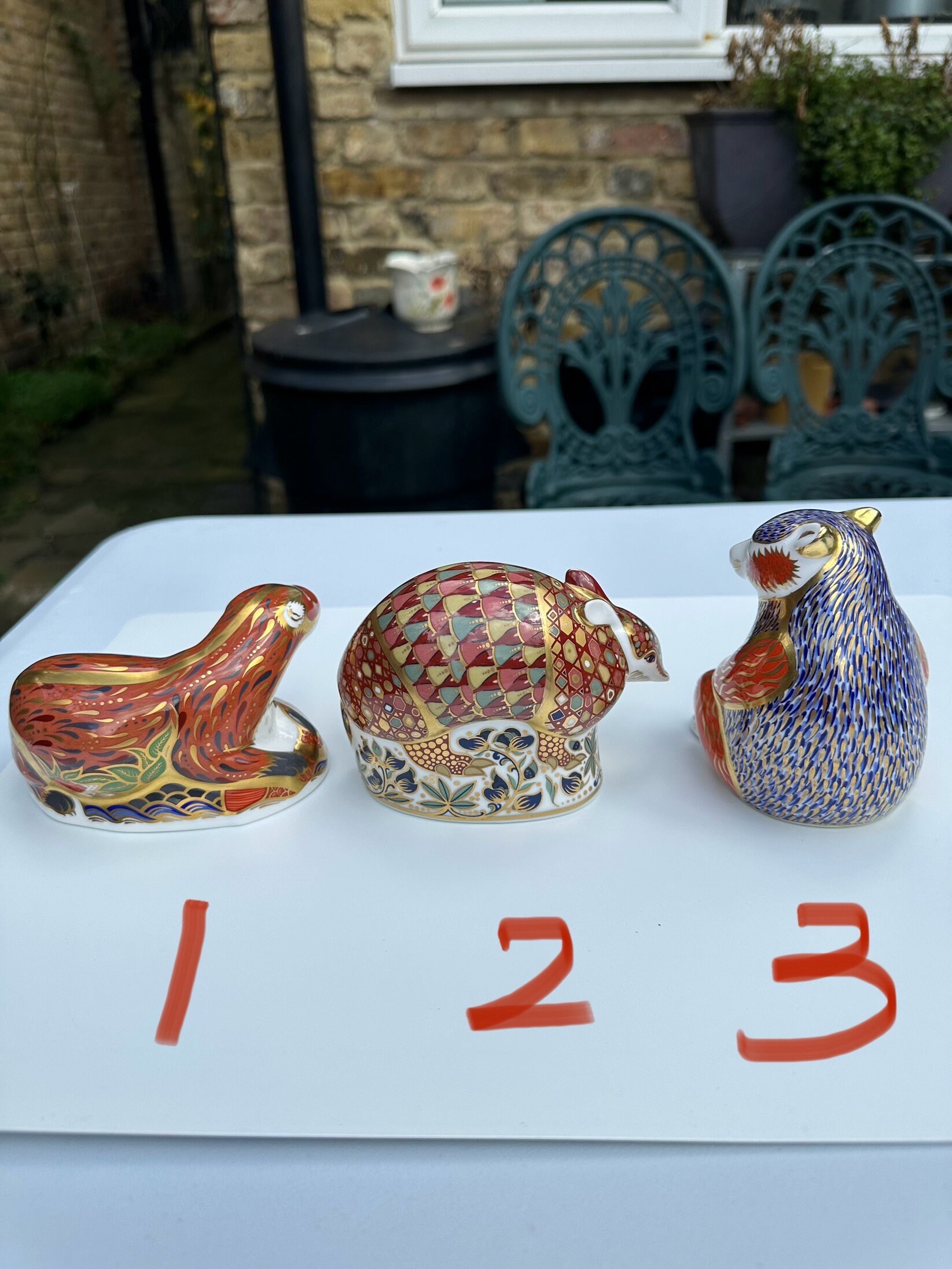 A Group of Royal Crown Derby Paperweights of an Otter, an Armadillo and ...