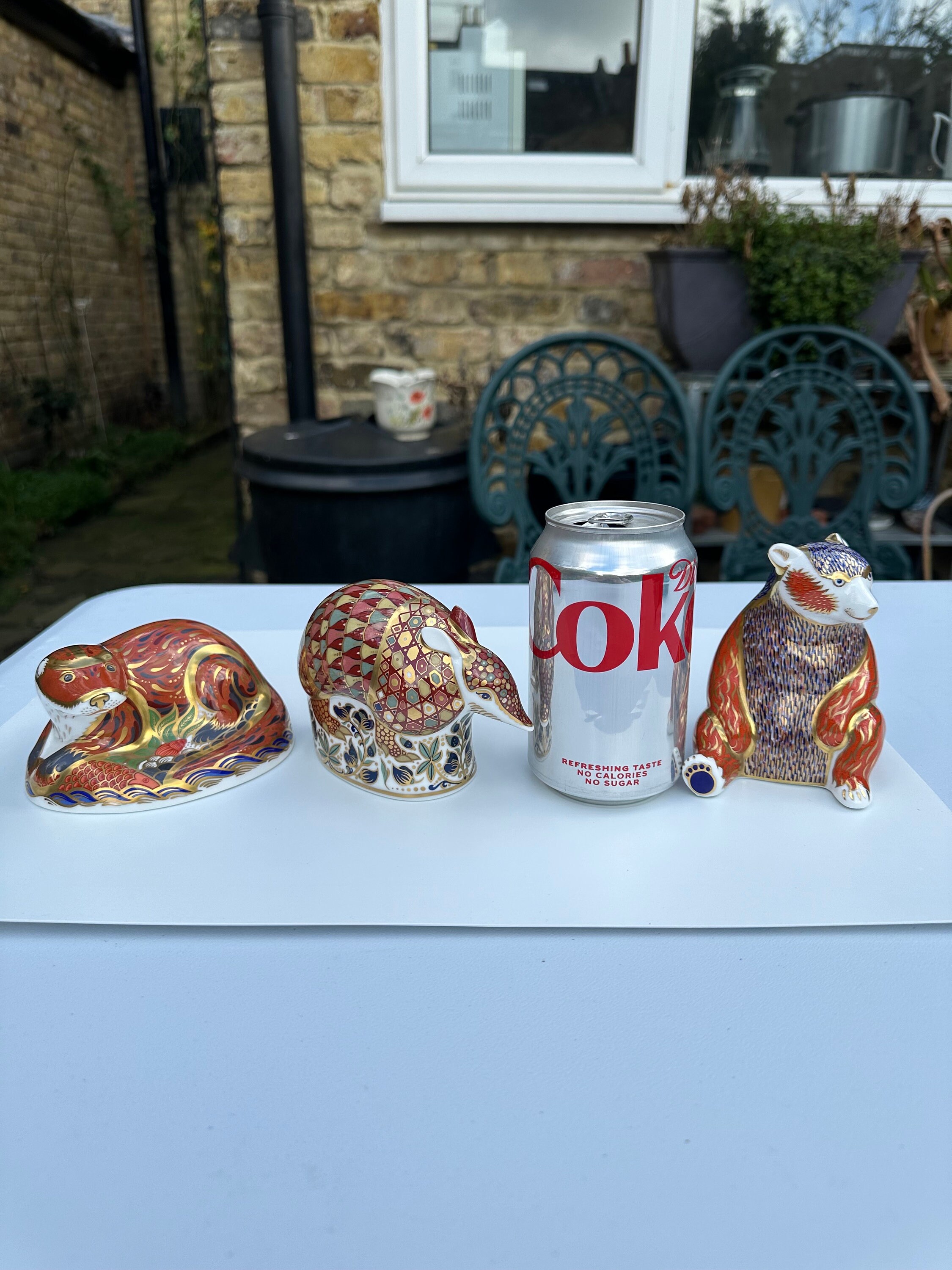 A Group of Royal Crown Derby Paperweights of an Otter, an Armadillo and ...