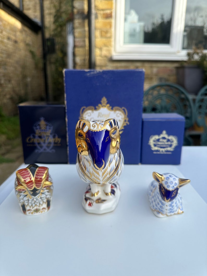 A Group of Royal Crown Derby Paperweights of A Large Ram, A Small Ram ...