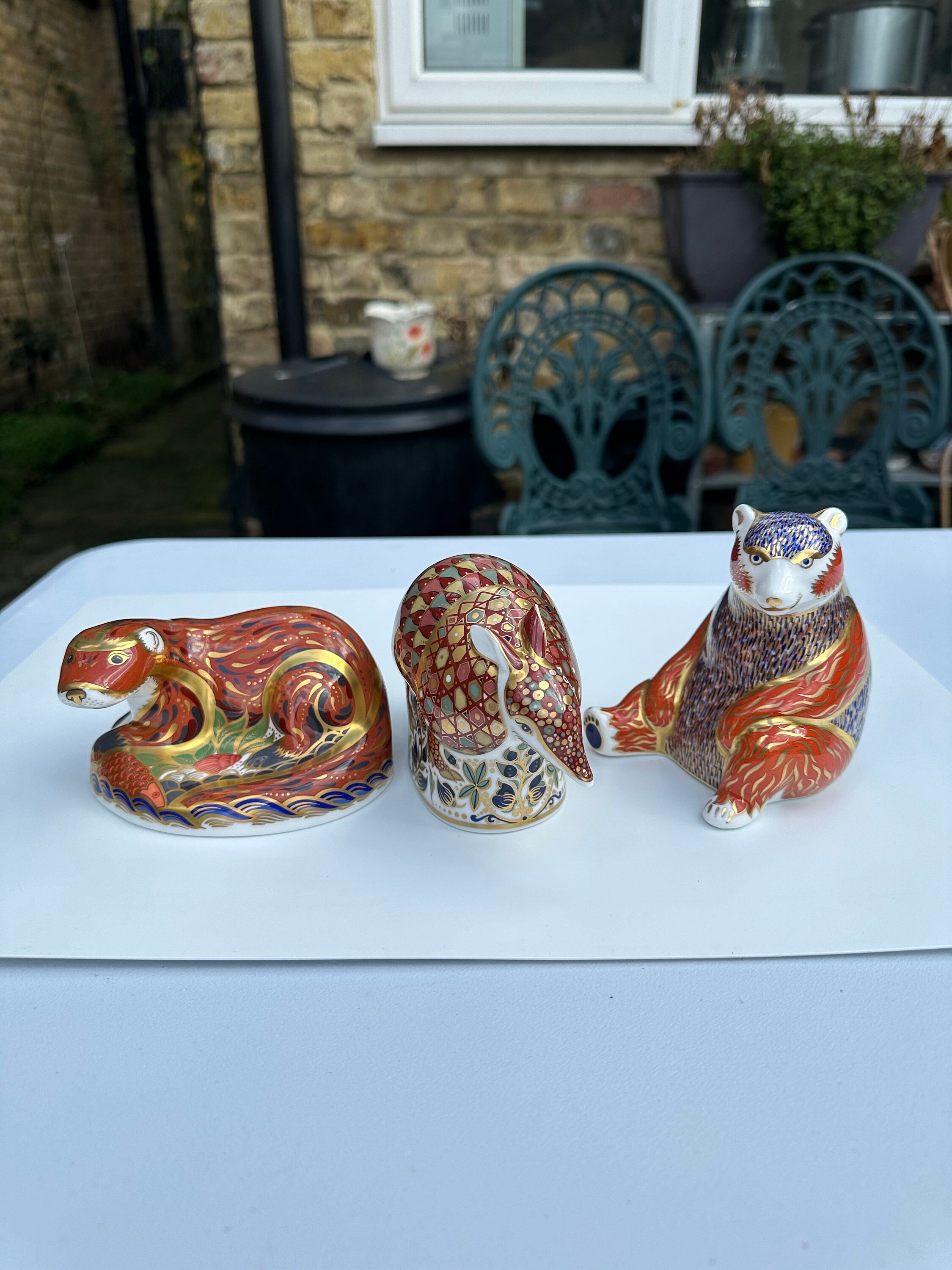 A Group of Royal Crown Derby Paperweights of an Otter, an Armadillo and ...