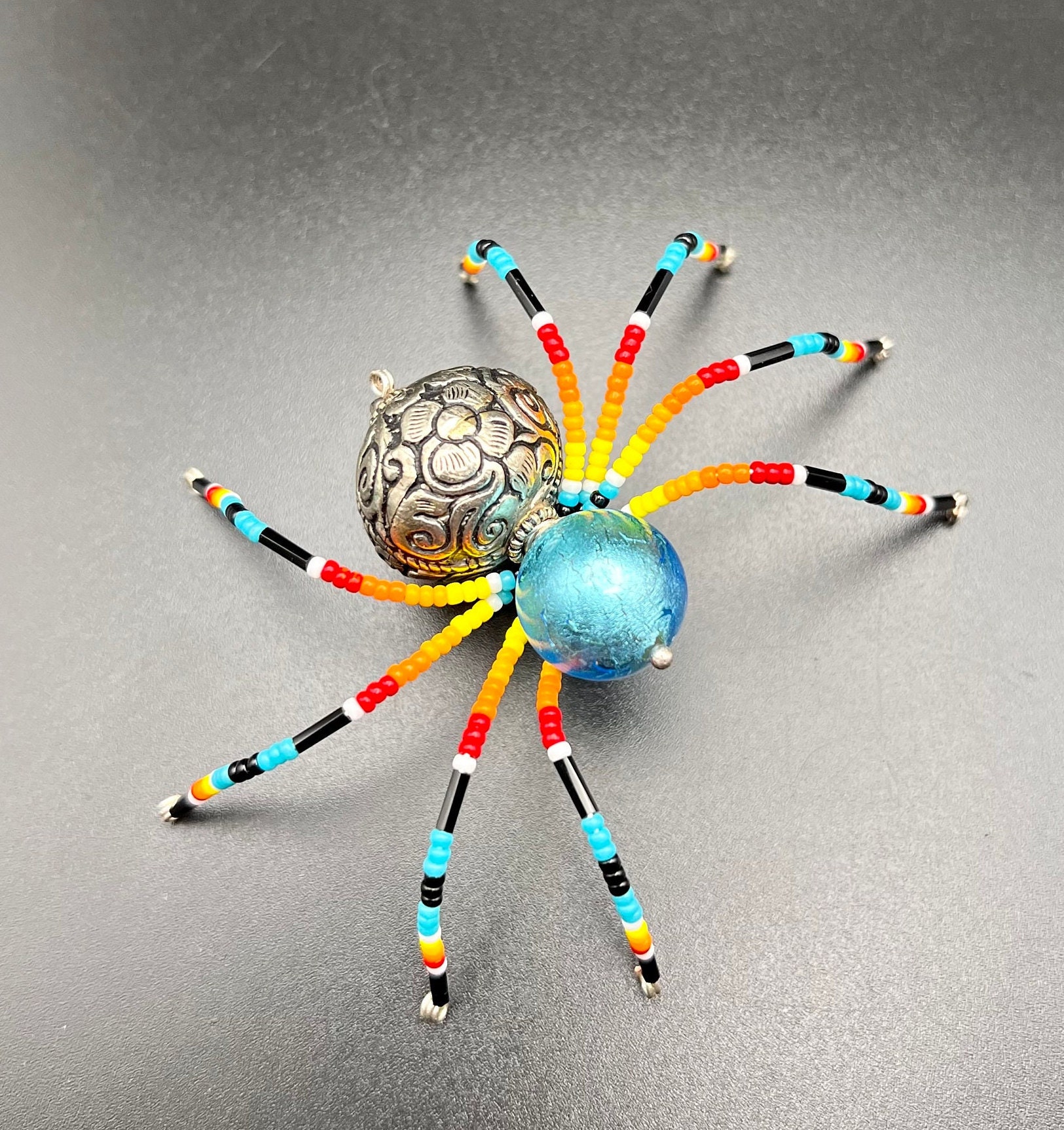 Bright Pattern Spider With Carved Brass Bead - Etsy