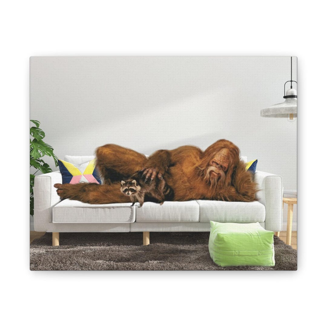 Sasquatch Wall Art With Racoon Resting on Couch Printable | Office Wall ...