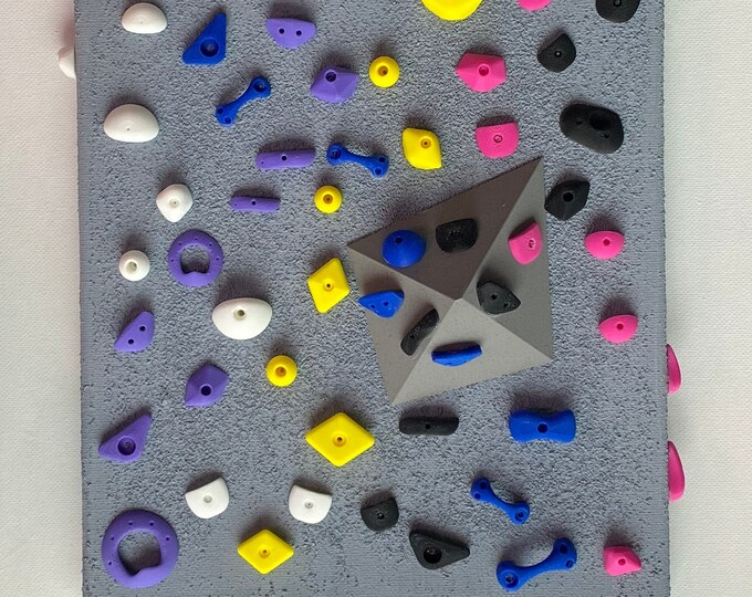 Mini Rock Wall: Various Color 3D Printed Rocks on a Textured Grey Wall ...