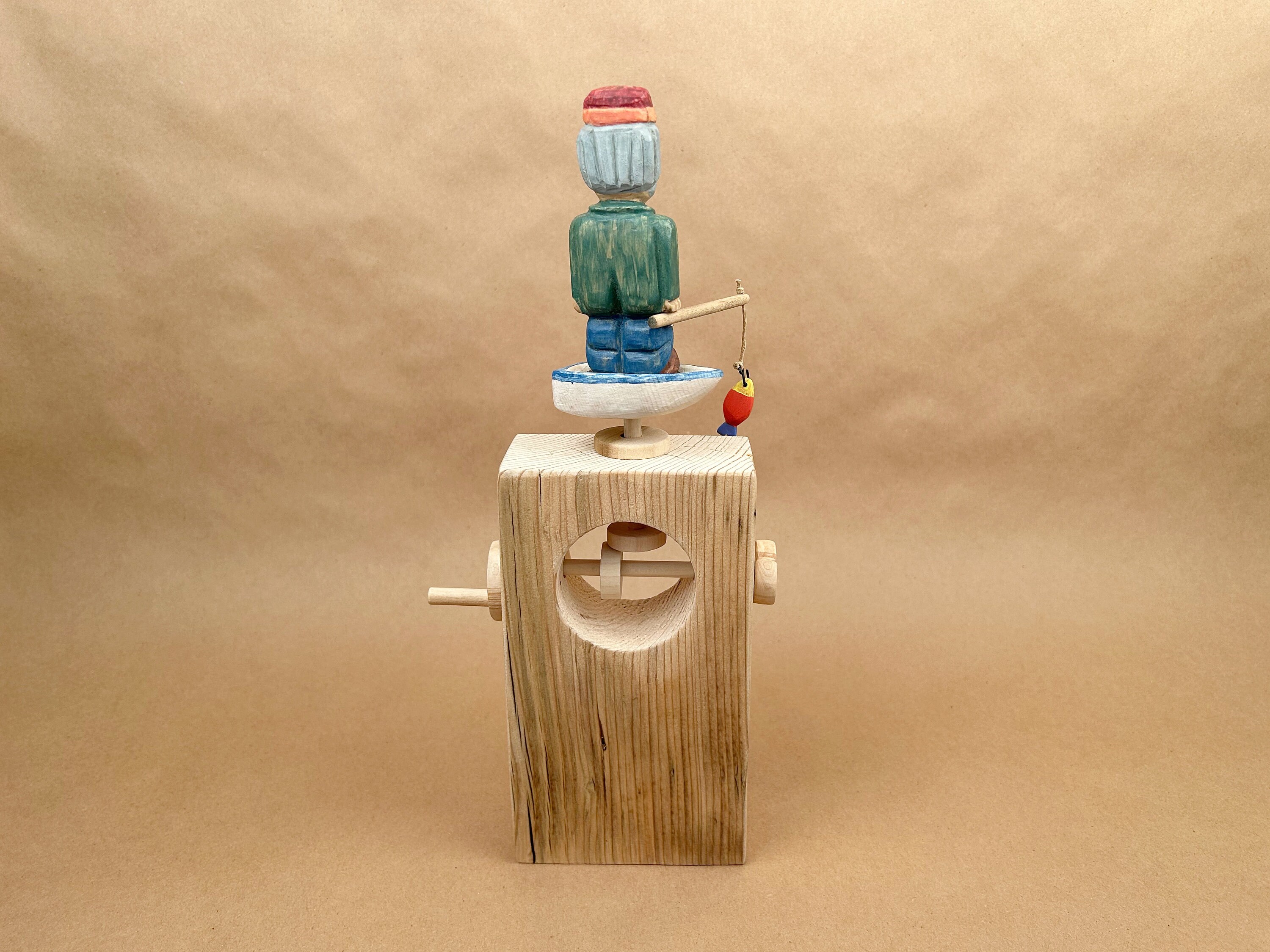 Smitty the Fisherman in His Boat Spinning Fish Tails on a Reclaimed ...