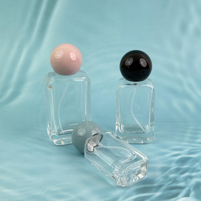 Elegant Glass Clear Spray Bottles With Colorful Sphere Caps ...