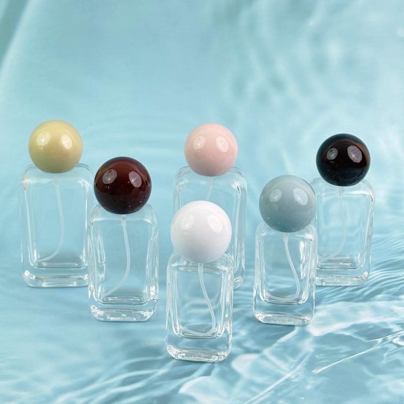Elegant Glass Clear Spray Bottles With Colorful Sphere Caps ...