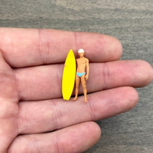 Lifeguard Chair and Tanned Surfer Dude With Surfboard. Miniature Human ...