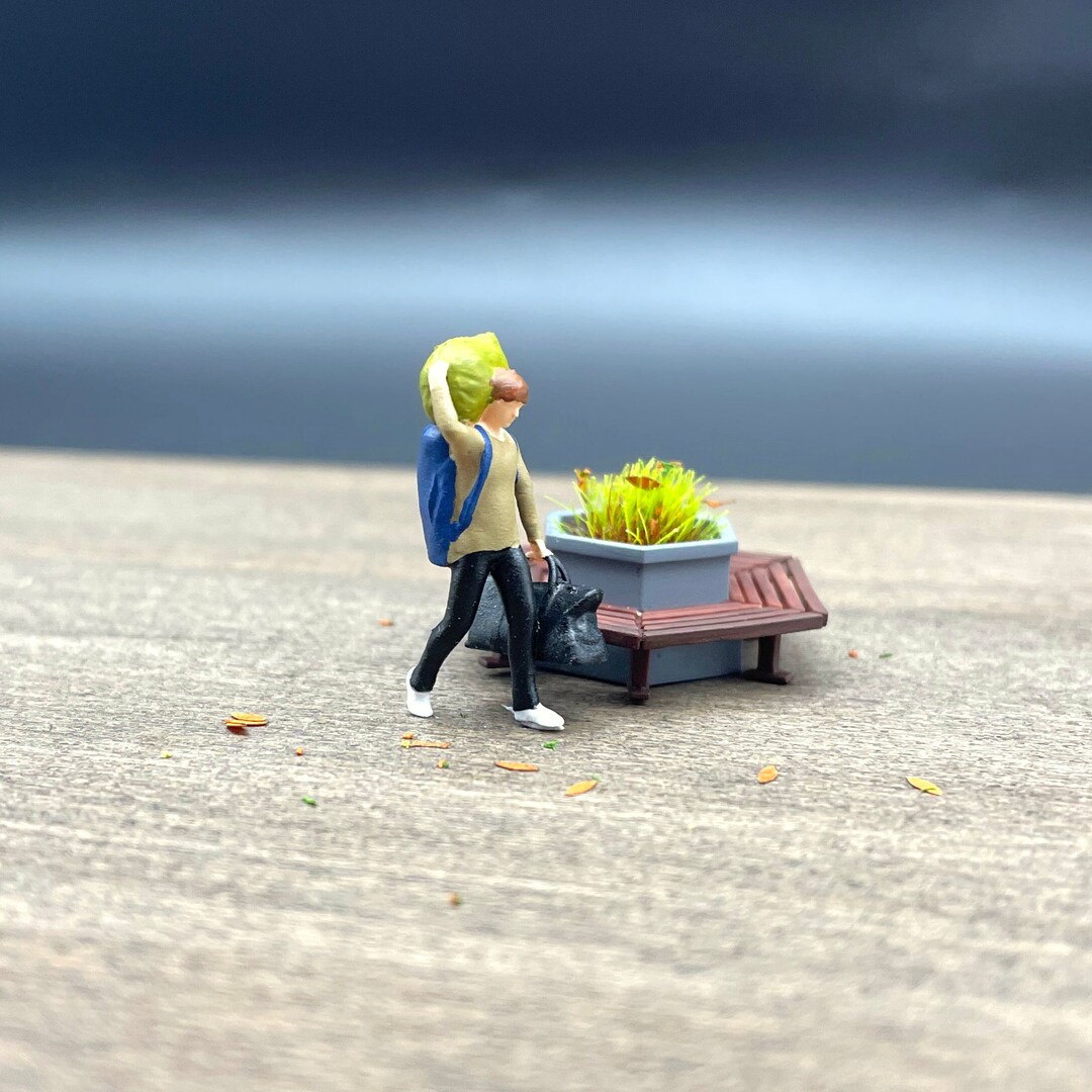 Boy Carrying Luggage. Backpacker / Traveller. Miniature Human Figure. 1 ...