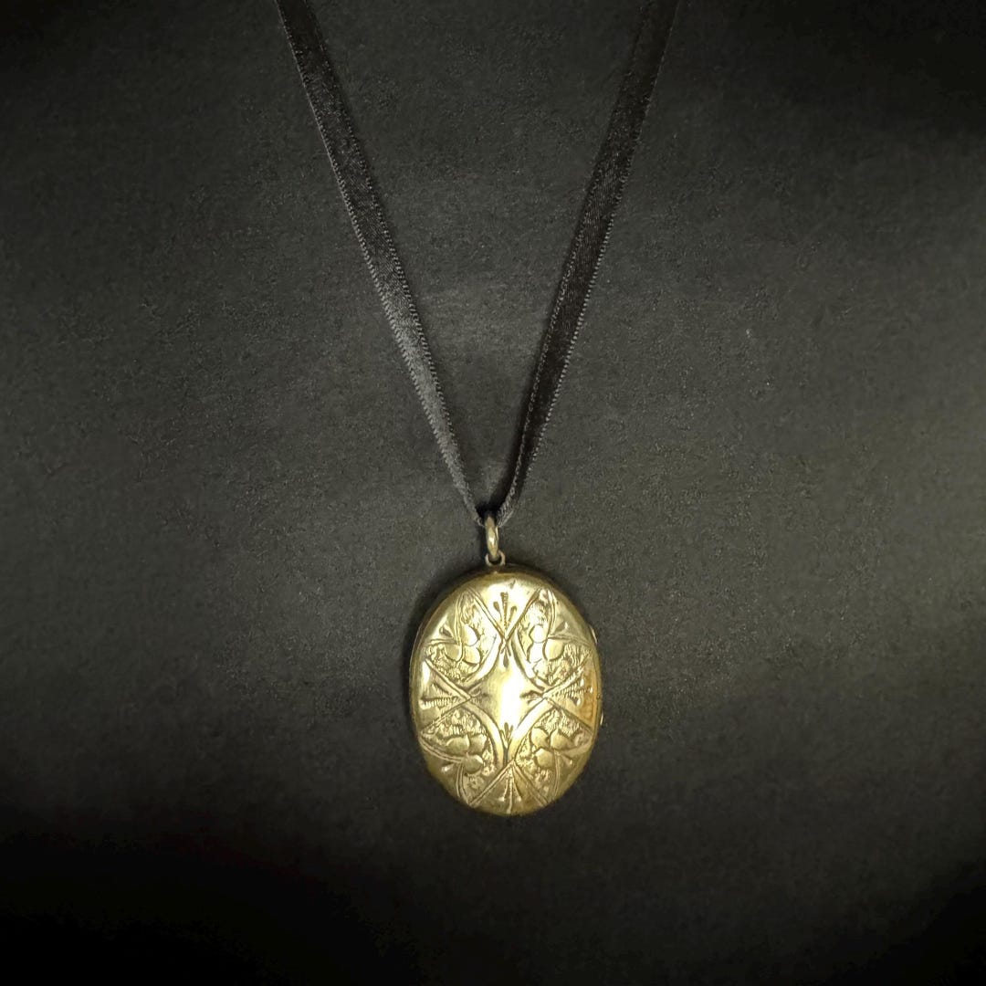 Antique Locket With Original Photographs. Antique Gilt Locket Hung on A ...