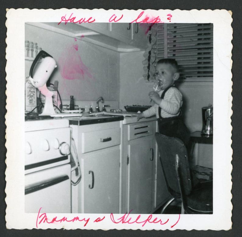 Mommy's Little Helper! Boy in Kitchen Stands on Chair Licking Mixer ...