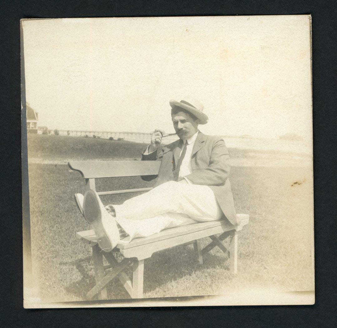 Dapper Pipe Smoking Gentleman Relaxes on Seaside Park Bench Original ...
