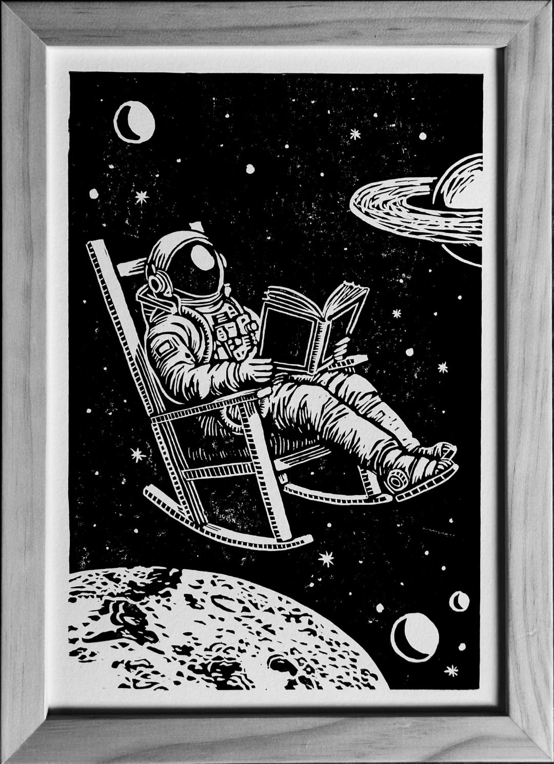 Reading in the Stars - an Astronaut Chilling in Space on His Rocking ...