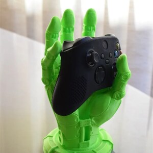 Robotic Hand Phone Holder Stand With Charging Cord Slot - Video Game ...