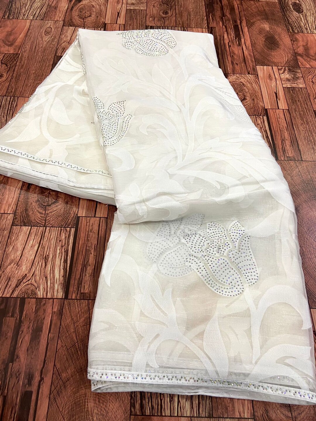Creamish Designer White Shimmer Brasso Saree With Beautiful Floral ...