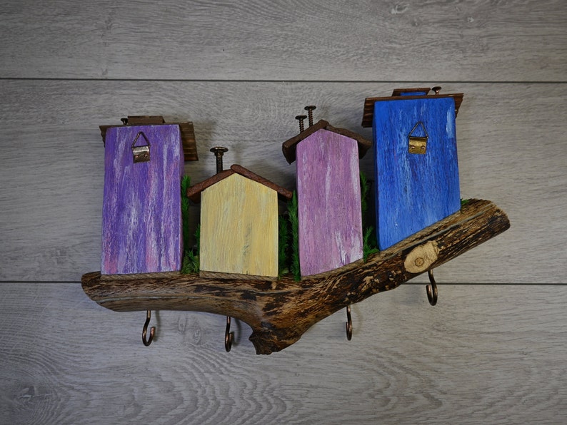 Wooden Key Holder With Colorful Houses and Green Plants on a Wild ...