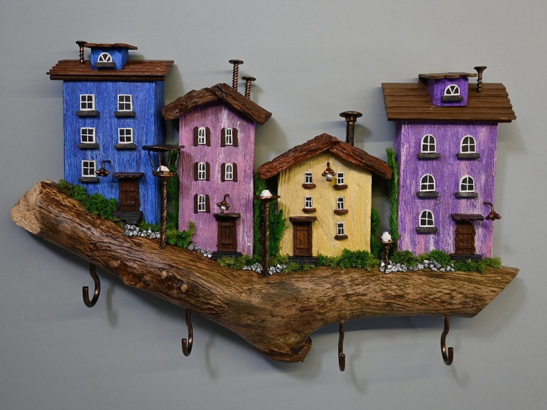 Wooden Key Holder With Colorful Houses and Green Plants on a Wild ...