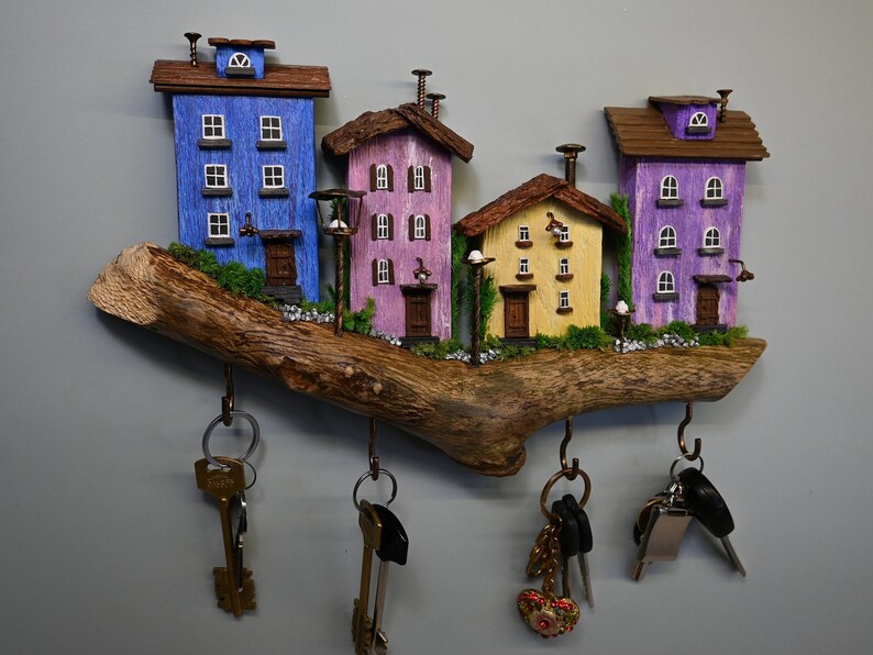 Wooden Key Holder With Colorful Houses and Green Plants on a Wild ...