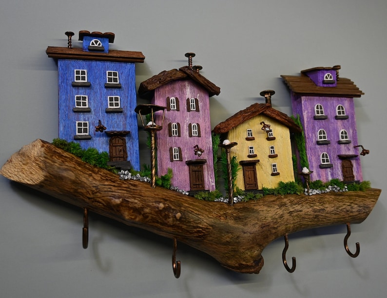 Wooden Key Holder With Colorful Houses and Green Plants on a Wild ...