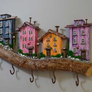 Wooden Key Holder With Colorful Houses and Green Plants on a Wild ...