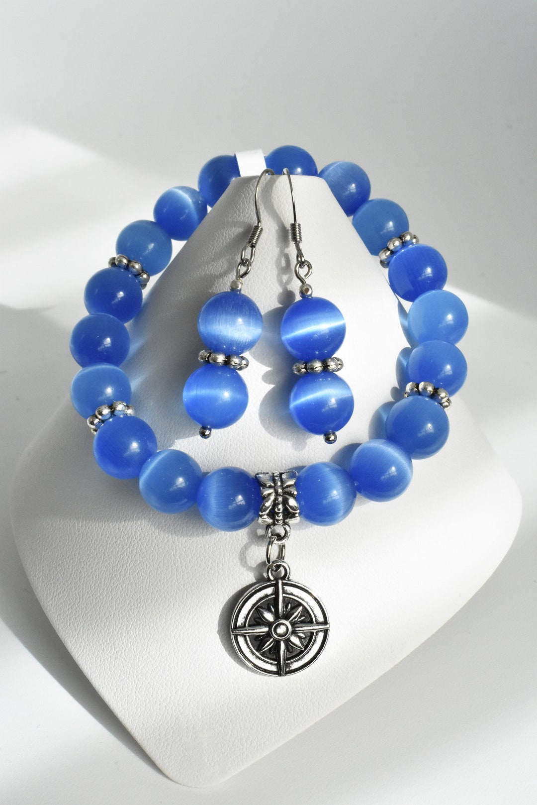 Light Blue Cats Eye Glass and Silver Plate Charm Bracelet and Earring ...