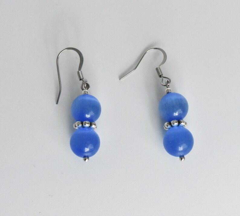 Light Blue Cats Eye Glass and Silver Plate Charm Bracelet and Earring ...