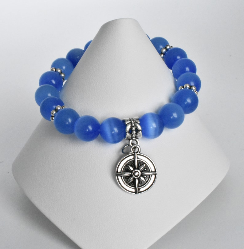 Light Blue Cats Eye Glass and Silver Plate Charm Bracelet and Earring ...